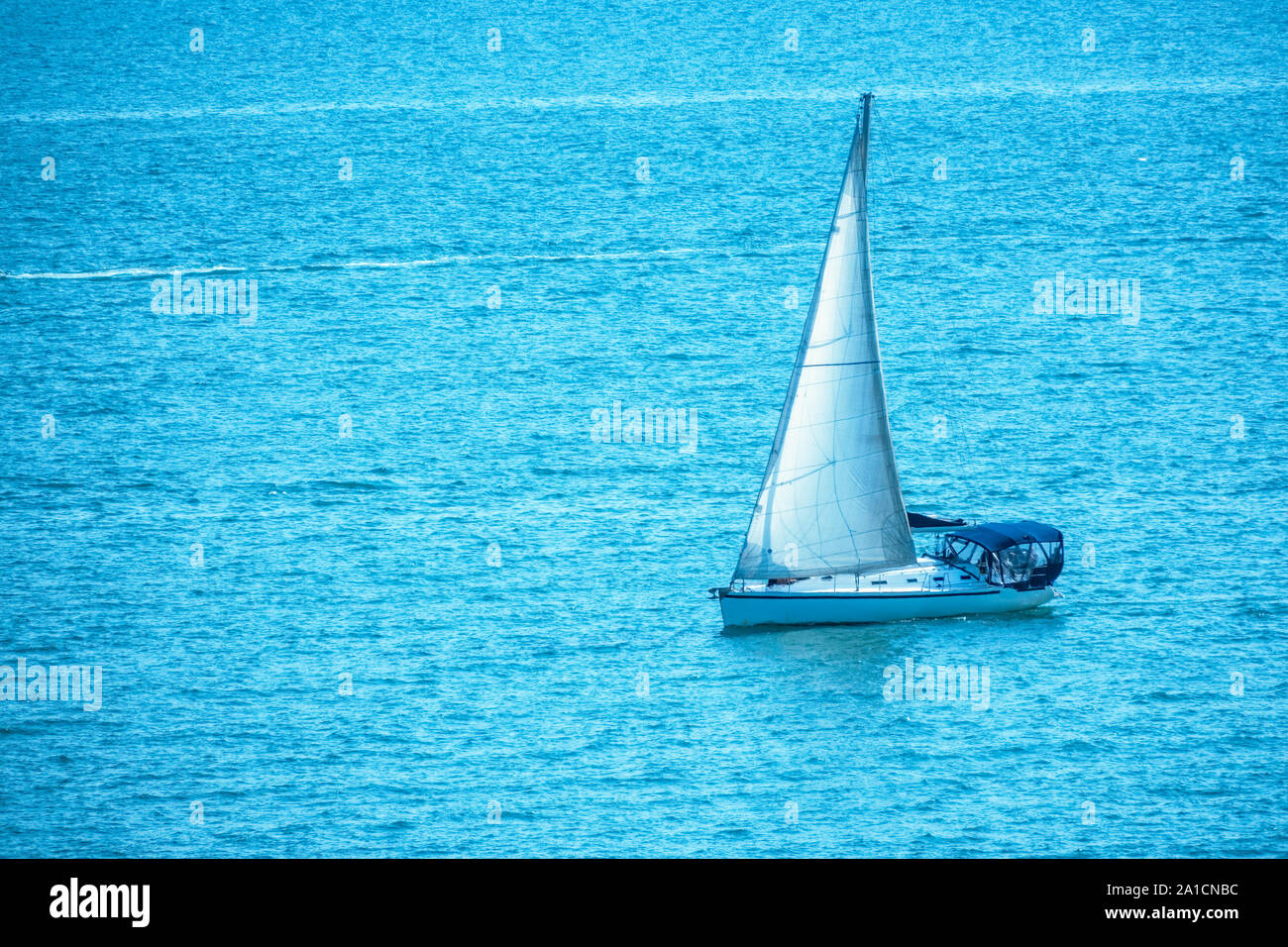 Sailing yacht in the blue calm sea. A yacht in peaceful waters Stock ...