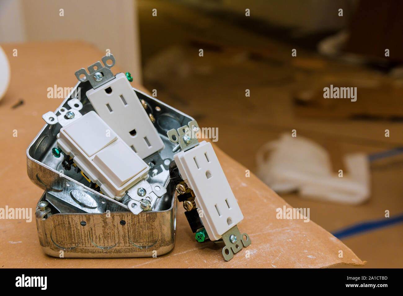 Preparing to install an electrical outlet, electrical metal steel boxes ...