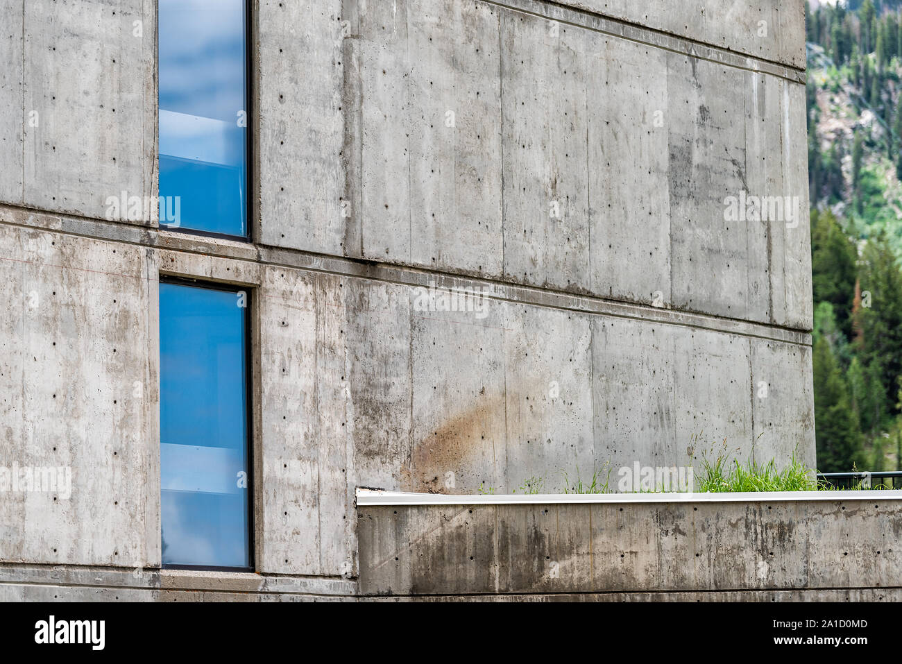 Brutalist architecture with concrete walls and glass windows abstract ...