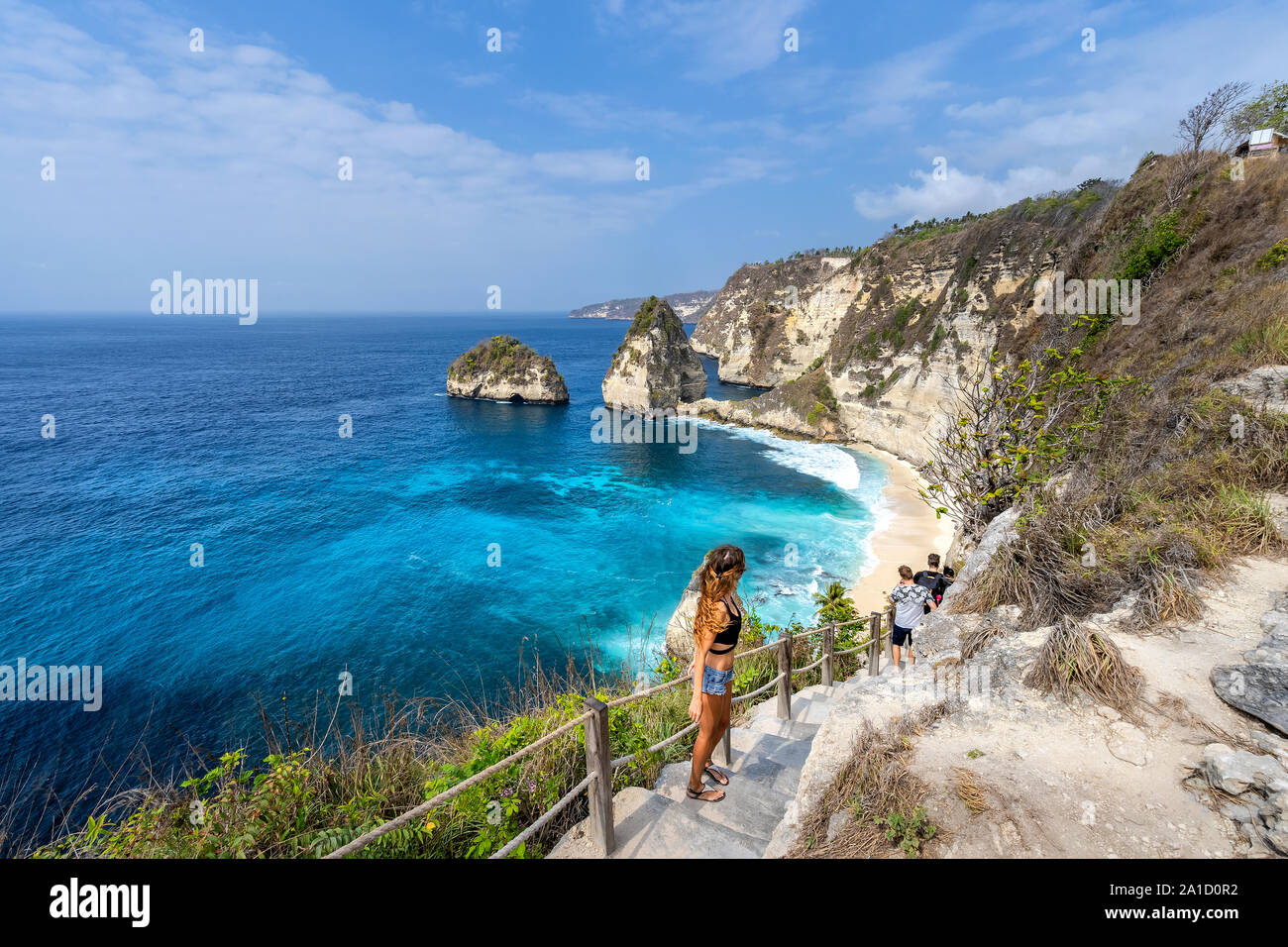 Aerial view of travel people with backpack and in shorts on the ocean ...