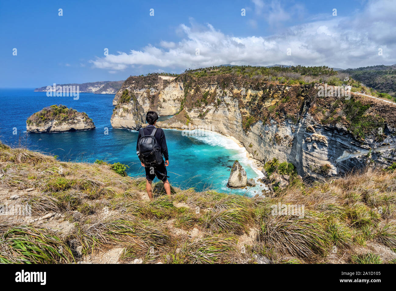 Aerial view of travel people with backpack and in shorts on the ocean ...
