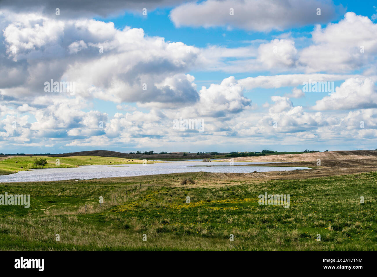 A lake is Saskatchewan Canada beside a farm Stock Photo - Alamy