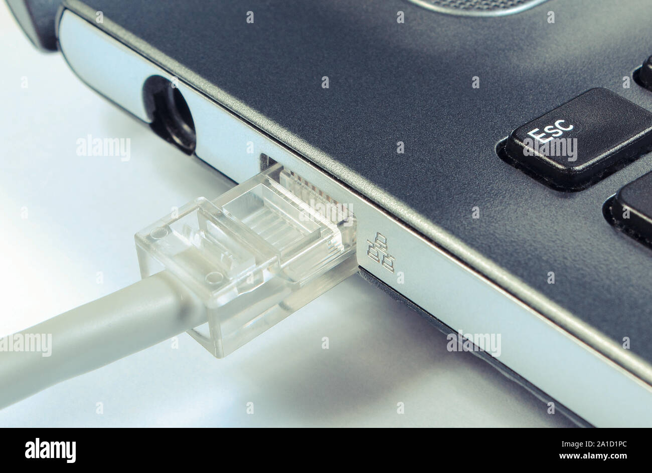 Connected patch cable to laptop. Plug with internet cable and laptop ...