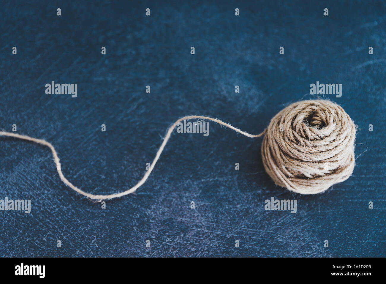 tangled ball of thread with string popping out of it, metaphor of ...