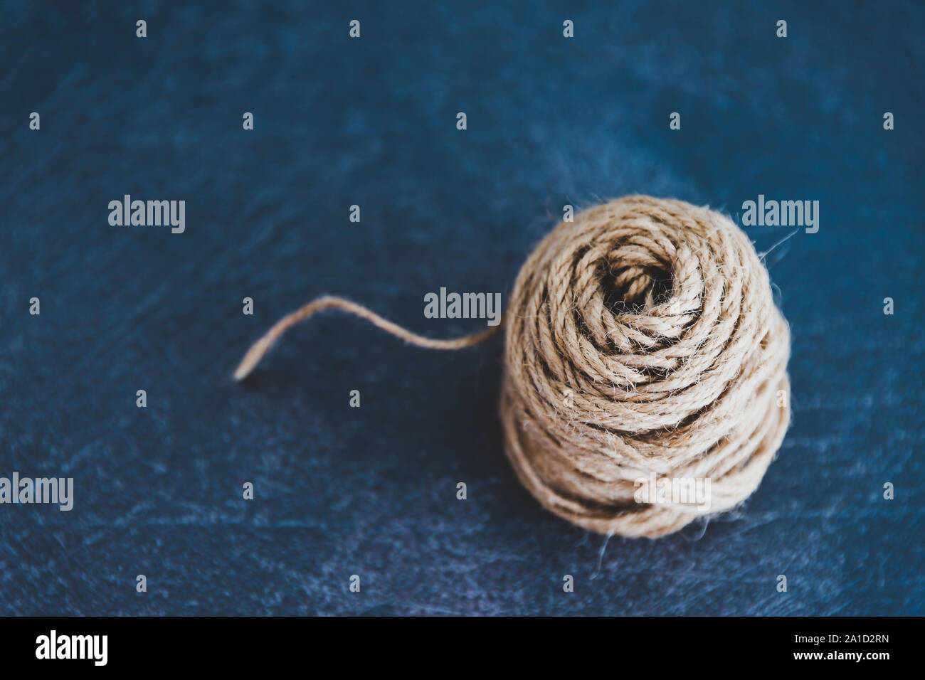 tangled ball of thread with string popping out of it, metaphor of ...