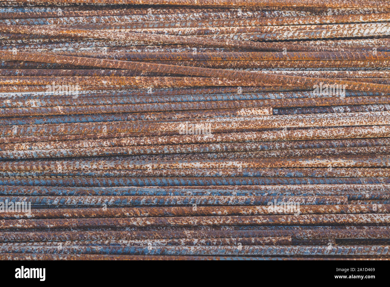 Background texture of old rusty steel bars construction materials in a ...
