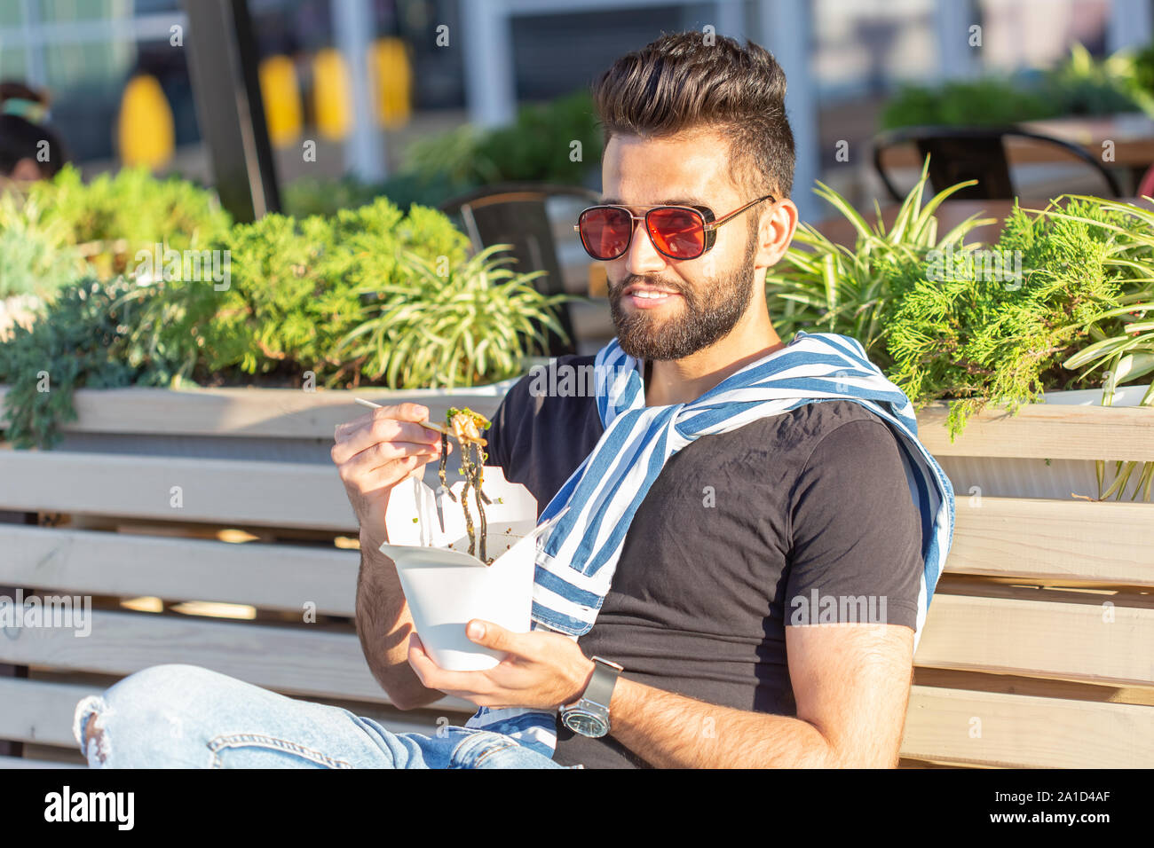 Male model sitting on box hi-res stock photography and images - Alamy