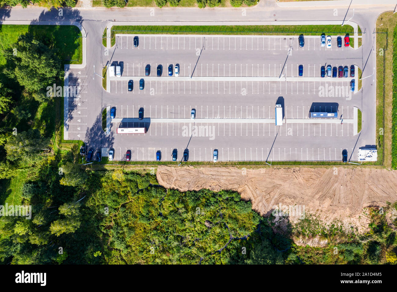outdoor parking lot in suburb district with parked cars at parking area ...