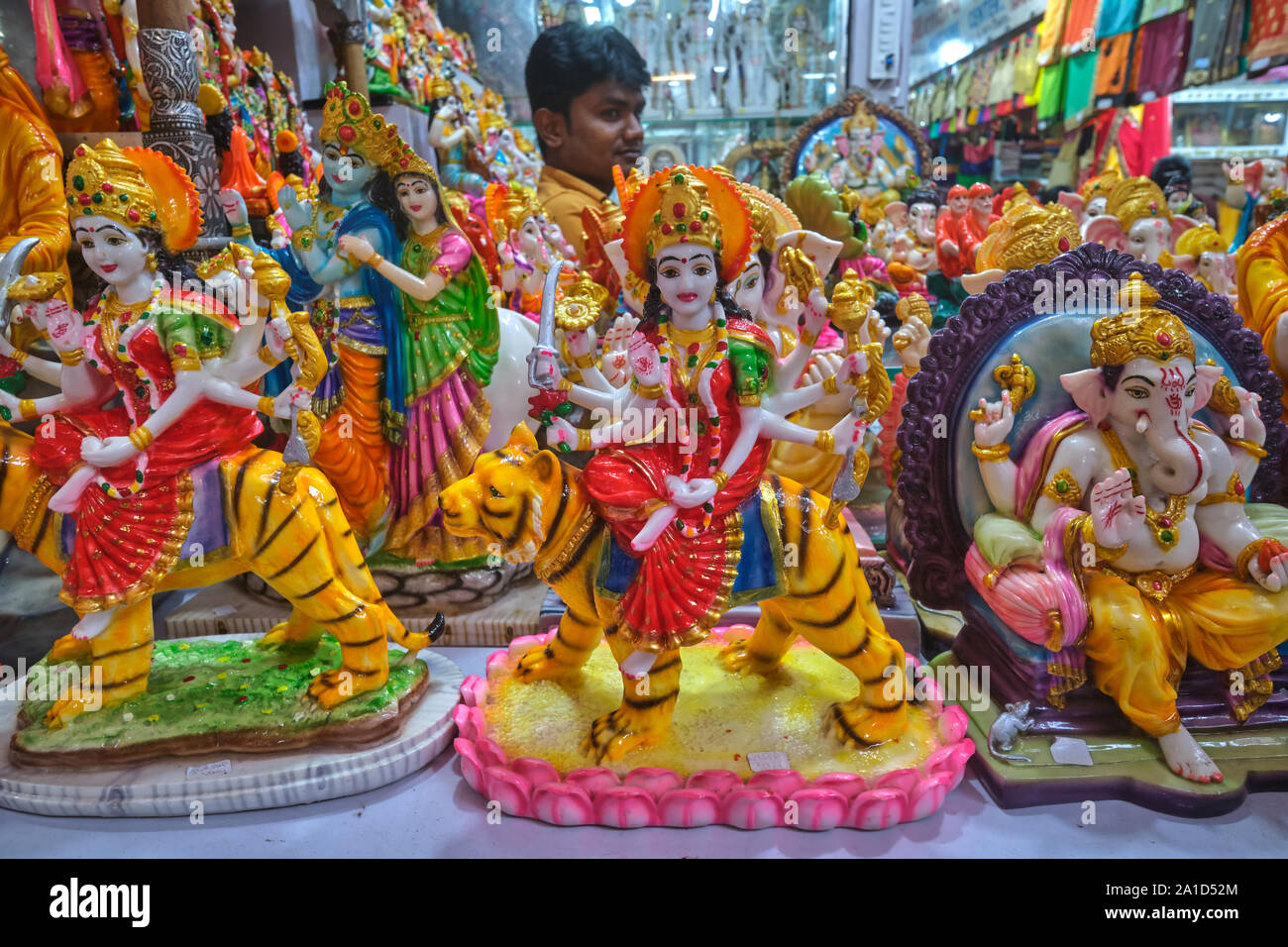 Colorful little figures of Hindu deities used in home shrines, on sale ...