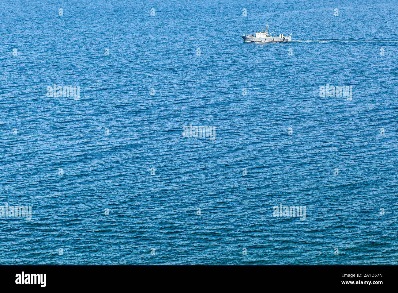 lone ship sailing in the middle of the ocean Stock Photo - Alamy