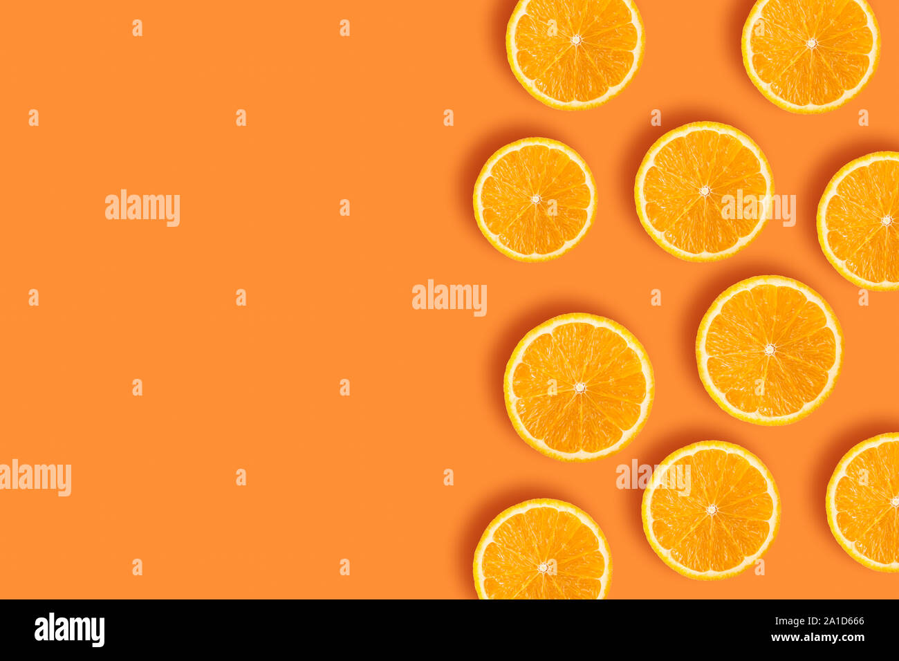 Pieces of orange on an orange background Stock Photo - Alamy