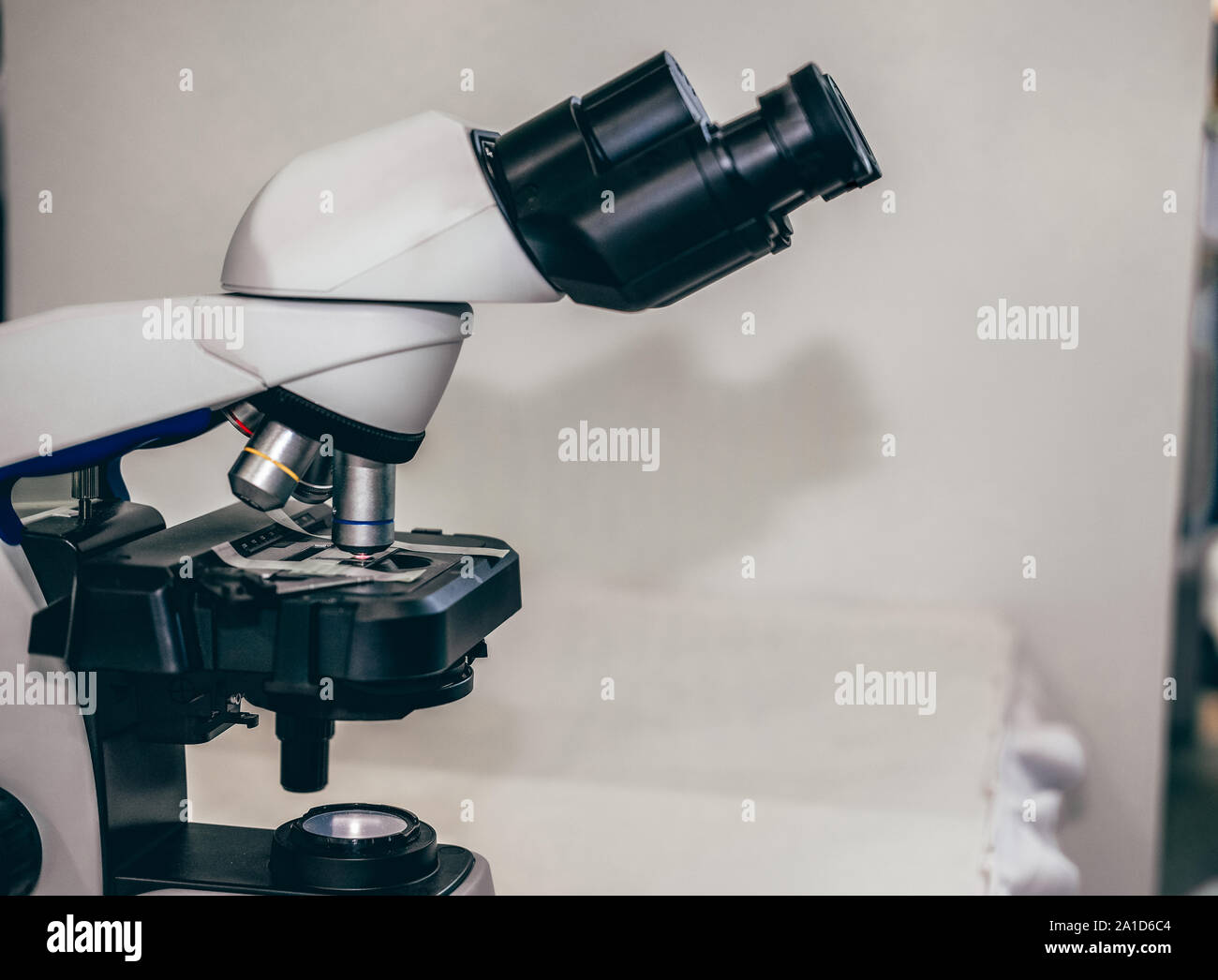 microscope for examining test sample in scientific laboratory. blur ...