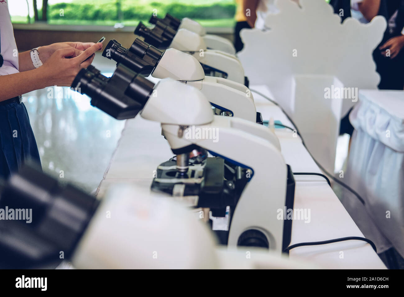 microscope for examining test sample in scientific laboratory. blur ...