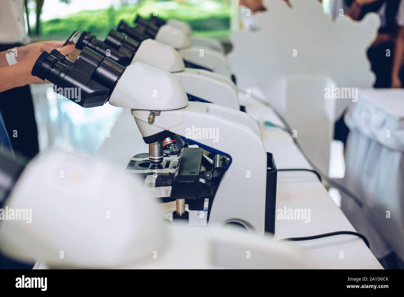 microscope for examining test sample in scientific laboratory. blur ...