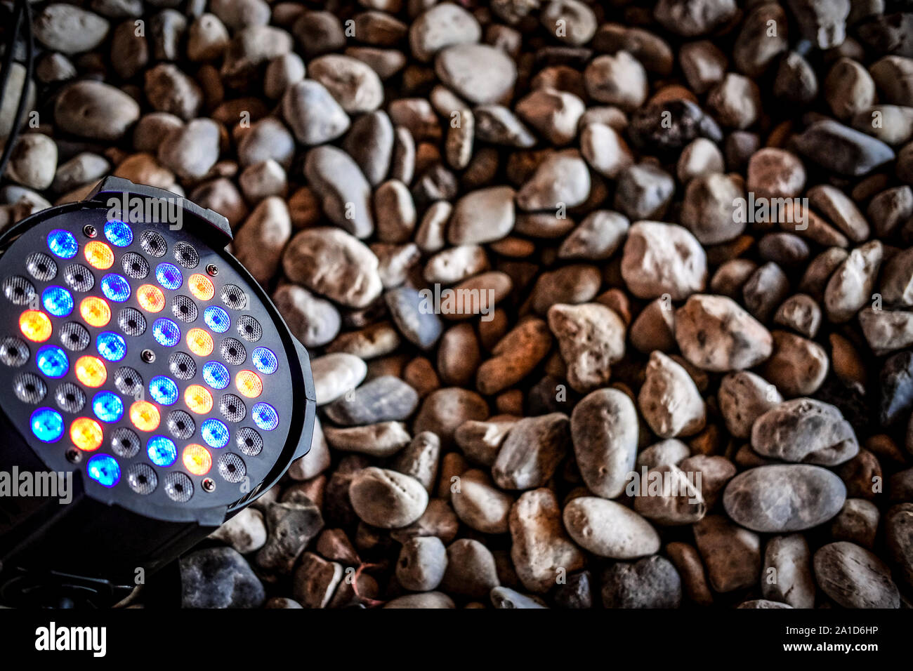 ground spotlight installed on stone rock floor Stock Photo - Alamy