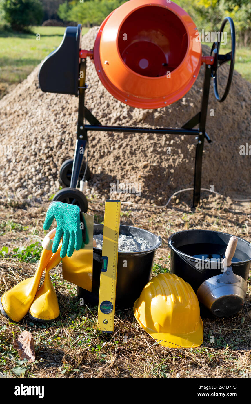 Picture of a brand new and clean orange concrete mixer ready to making ...