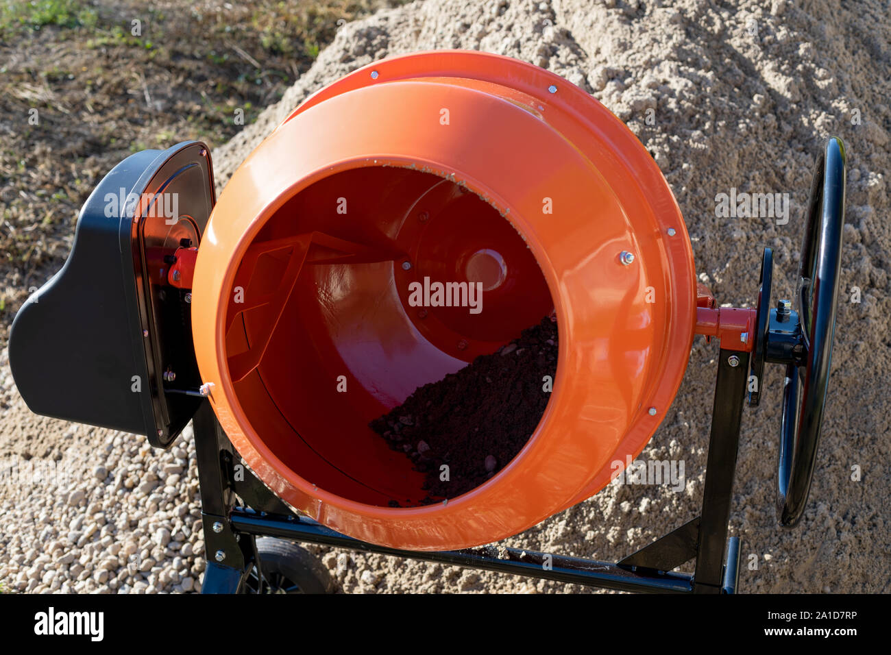 Picture of a brand new and clean orange concrete mixer ready to making ...