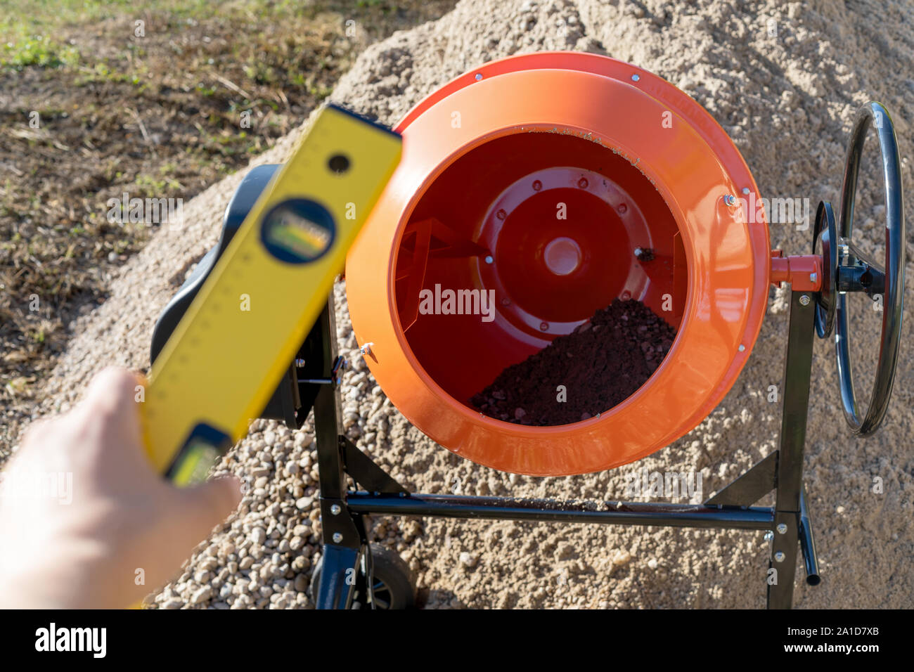 Picture of a brand new and clean orange concrete mixer ready to making ...