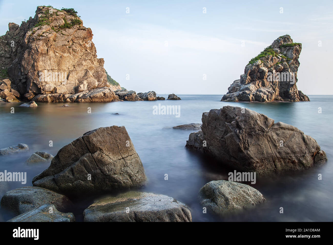 horizontal landscape the cliff coast with stones and a huge rock at ...