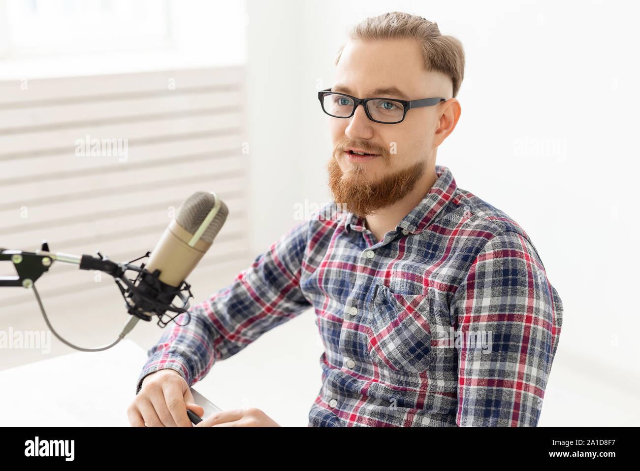 Radio host concept - Side view of handsome man working as radio host at ...