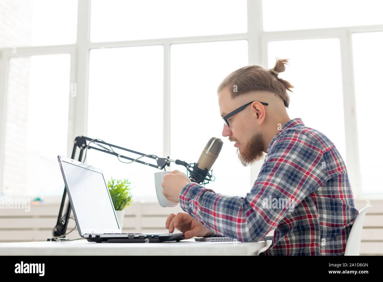 Radio host concept - Side view of handsome man working as radio host at ...