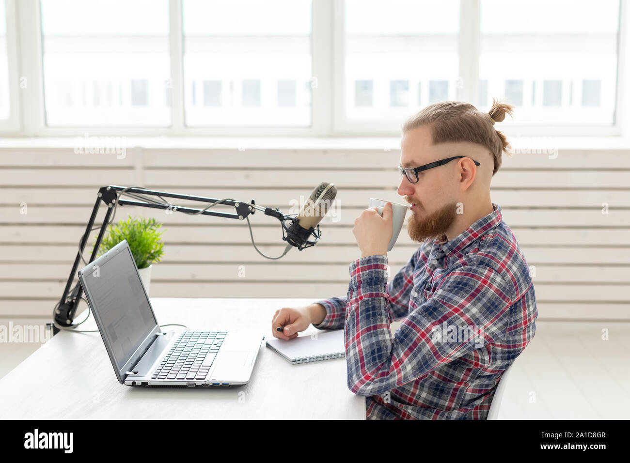 Radio host concept - Handsome man working as radio host at radio ...