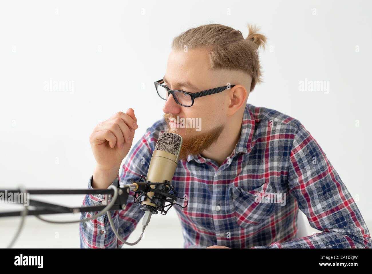 Radio host concept - Handsome man working as radio host at radio ...