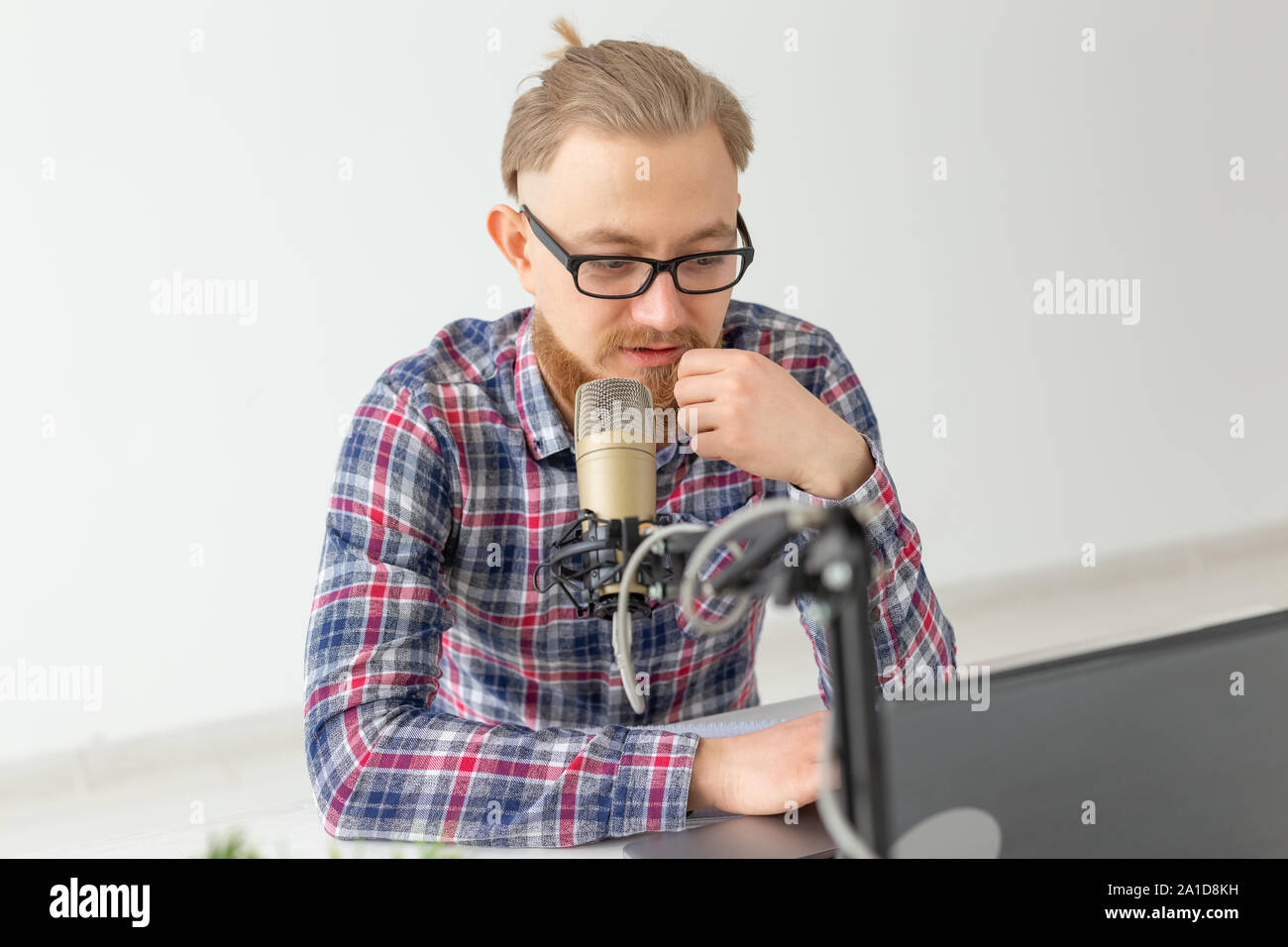 Radio host concept - Side view of handsome man working as radio host at ...