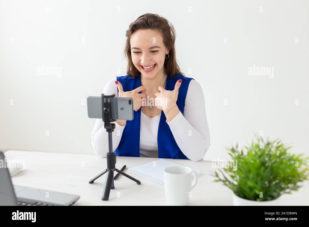 Blogging and vlog concept - young woman blogger talking on the camera ...
