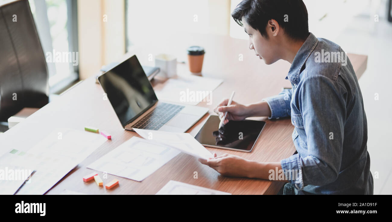 Professional male UI web developer working on his project about UX ...