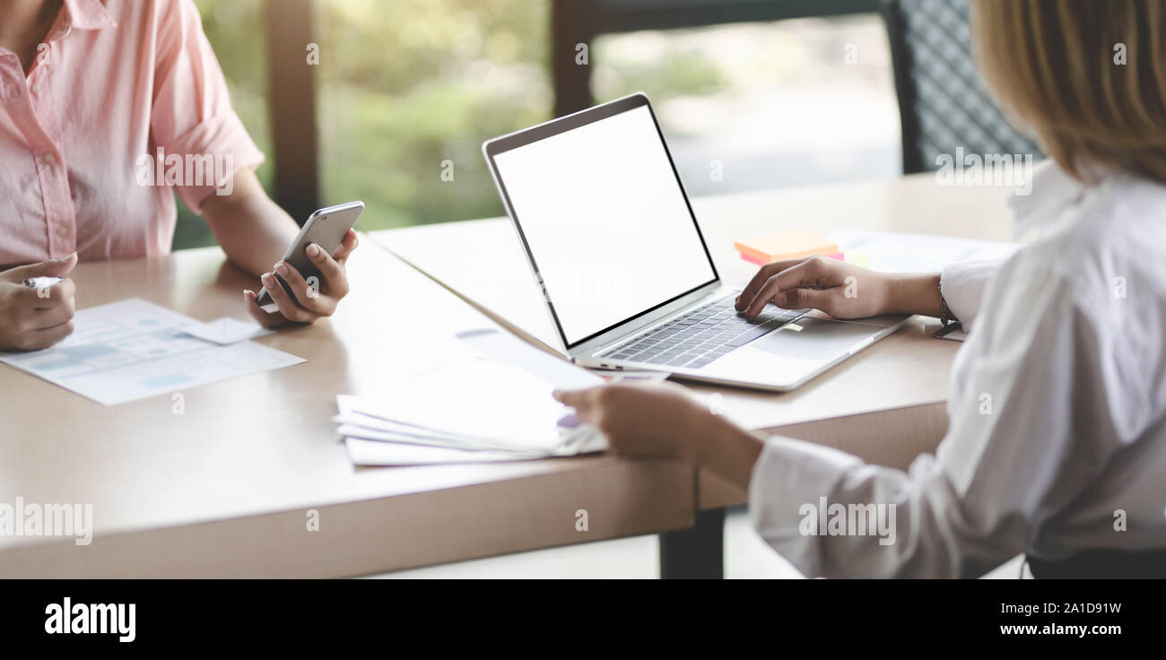 Team of UI web developer working on their project on smartphone ...