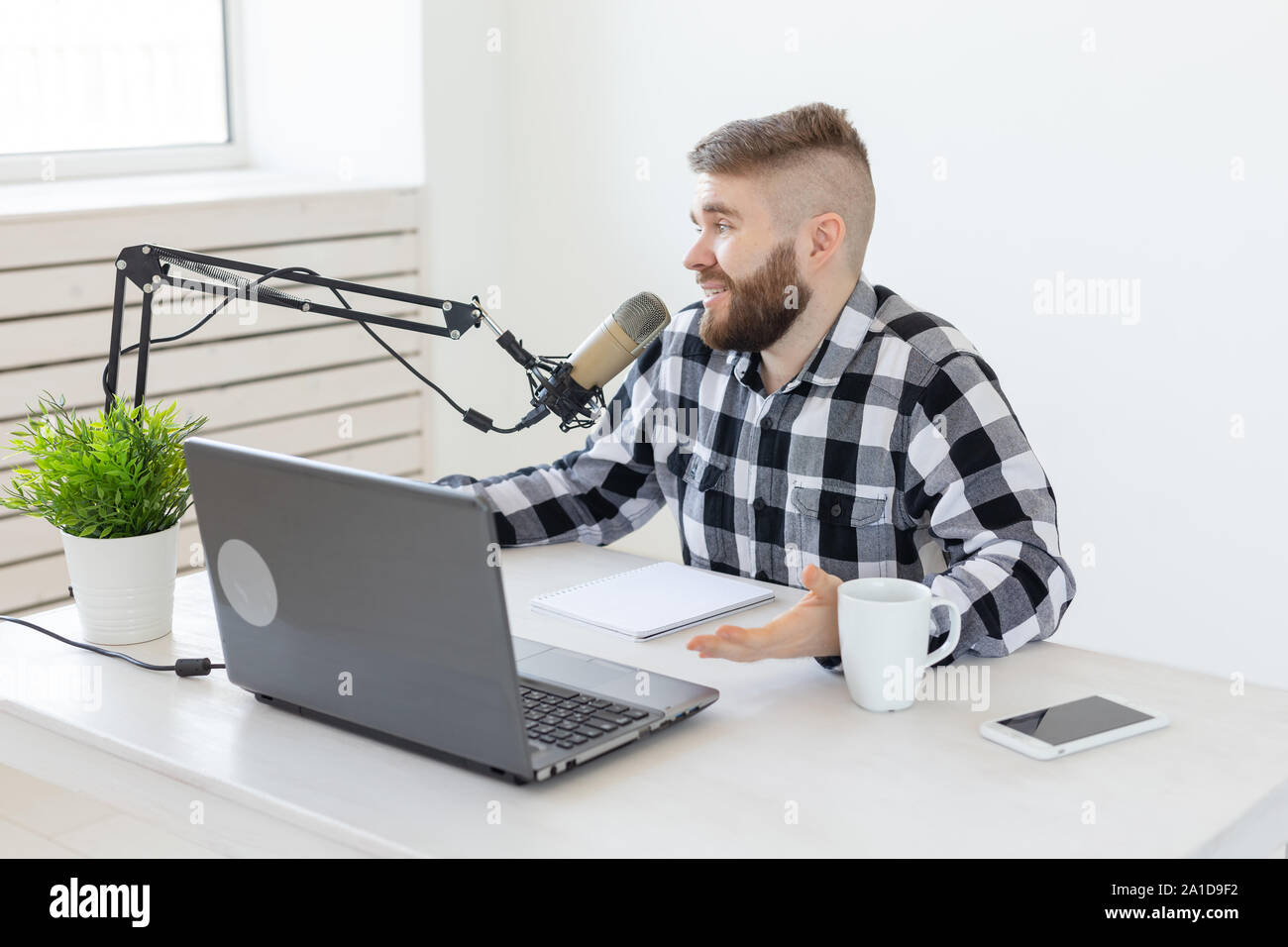 Streamer, blogger and media concept - radio dj working at studio Stock ...