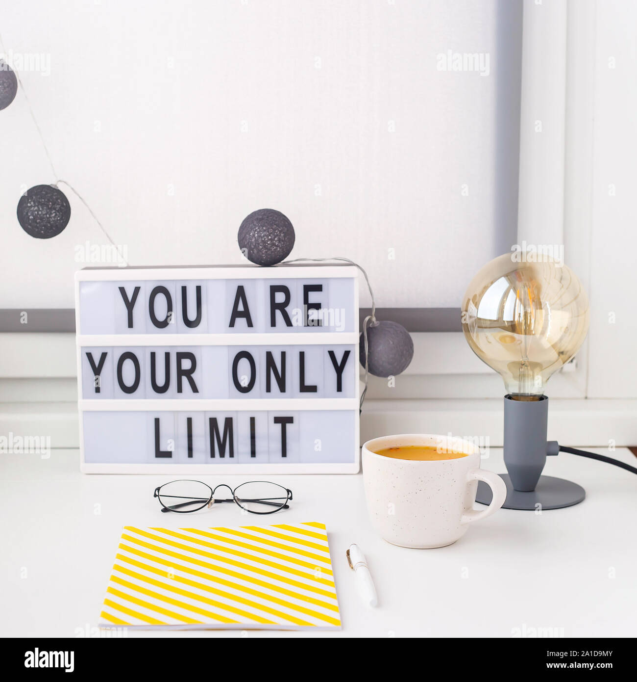 You are your only limit framed in a modern workplace with a notebook ...