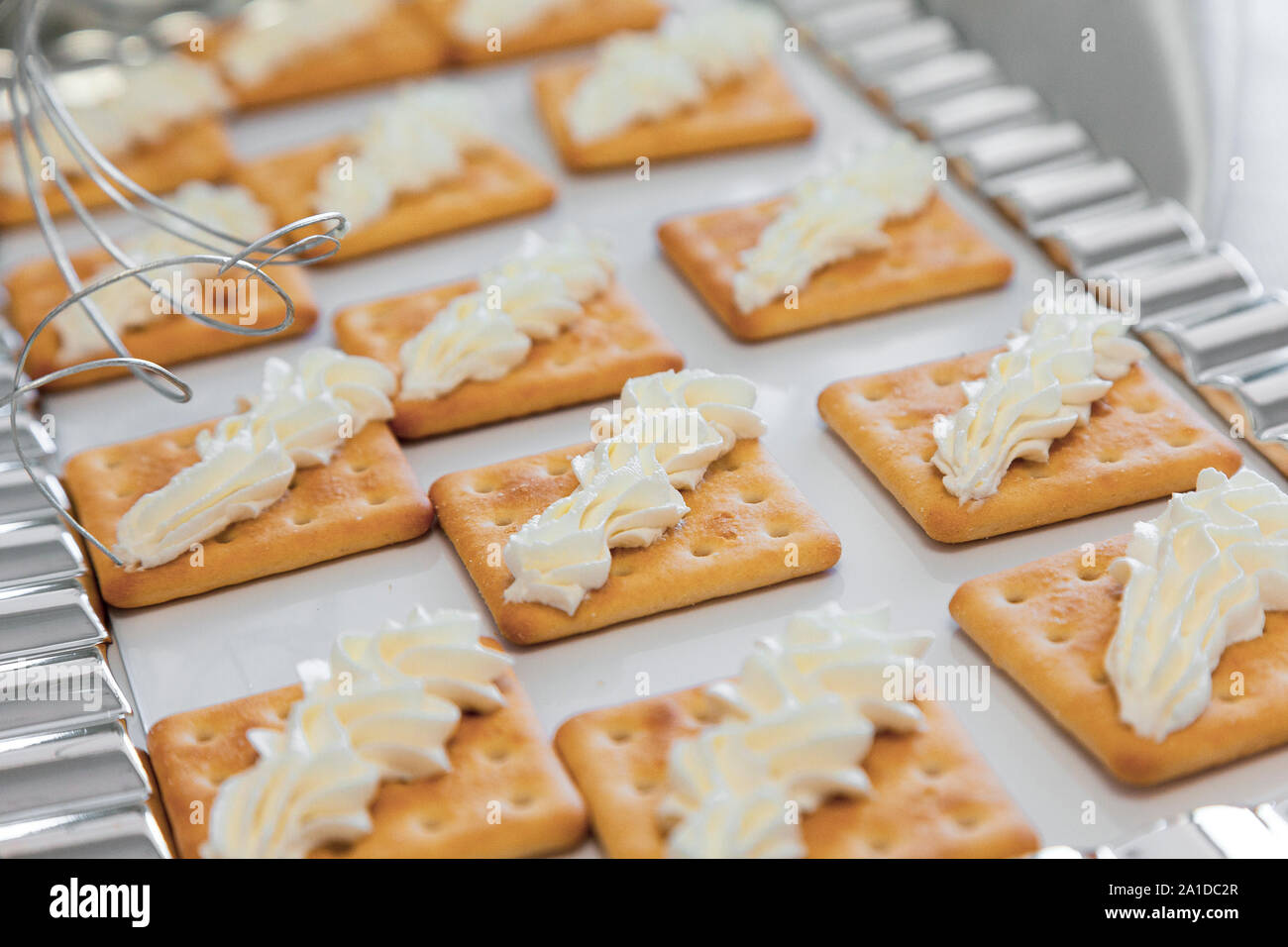 Snacks with Cream on cookies Stock Photo - Alamy