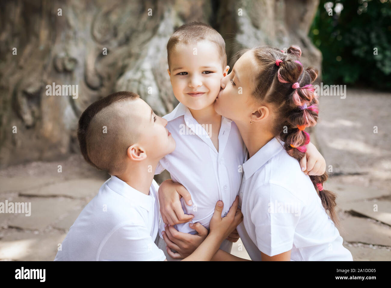 hugging and kissing children Stock Photo - Alamy