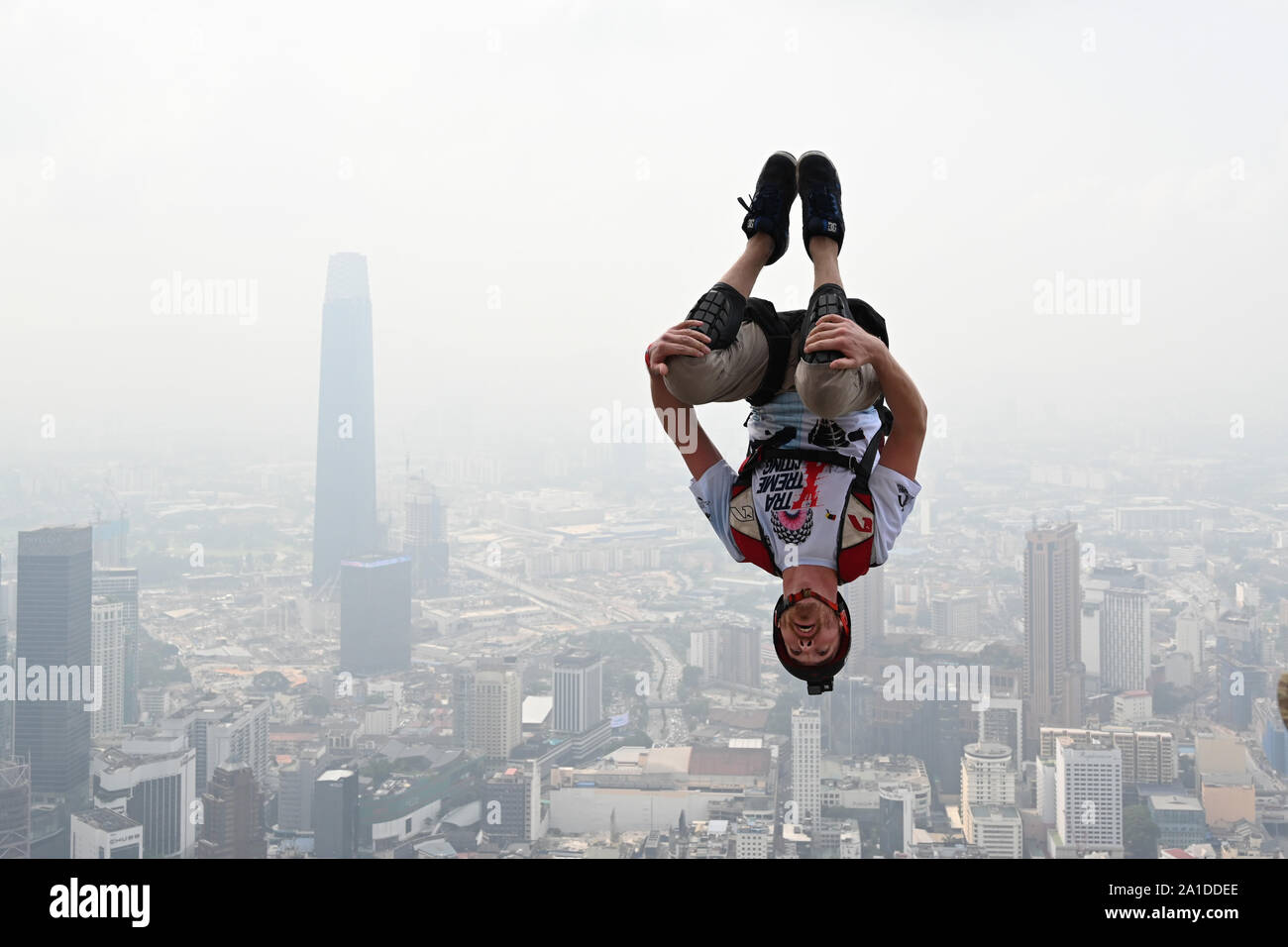 Kuala Lumpur, Malaysia. 26th Sep, 2019. A base jumper leaps from Kuala ...