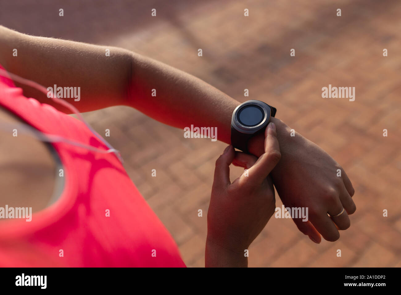 Woman checking smartwatch Stock Photo - Alamy