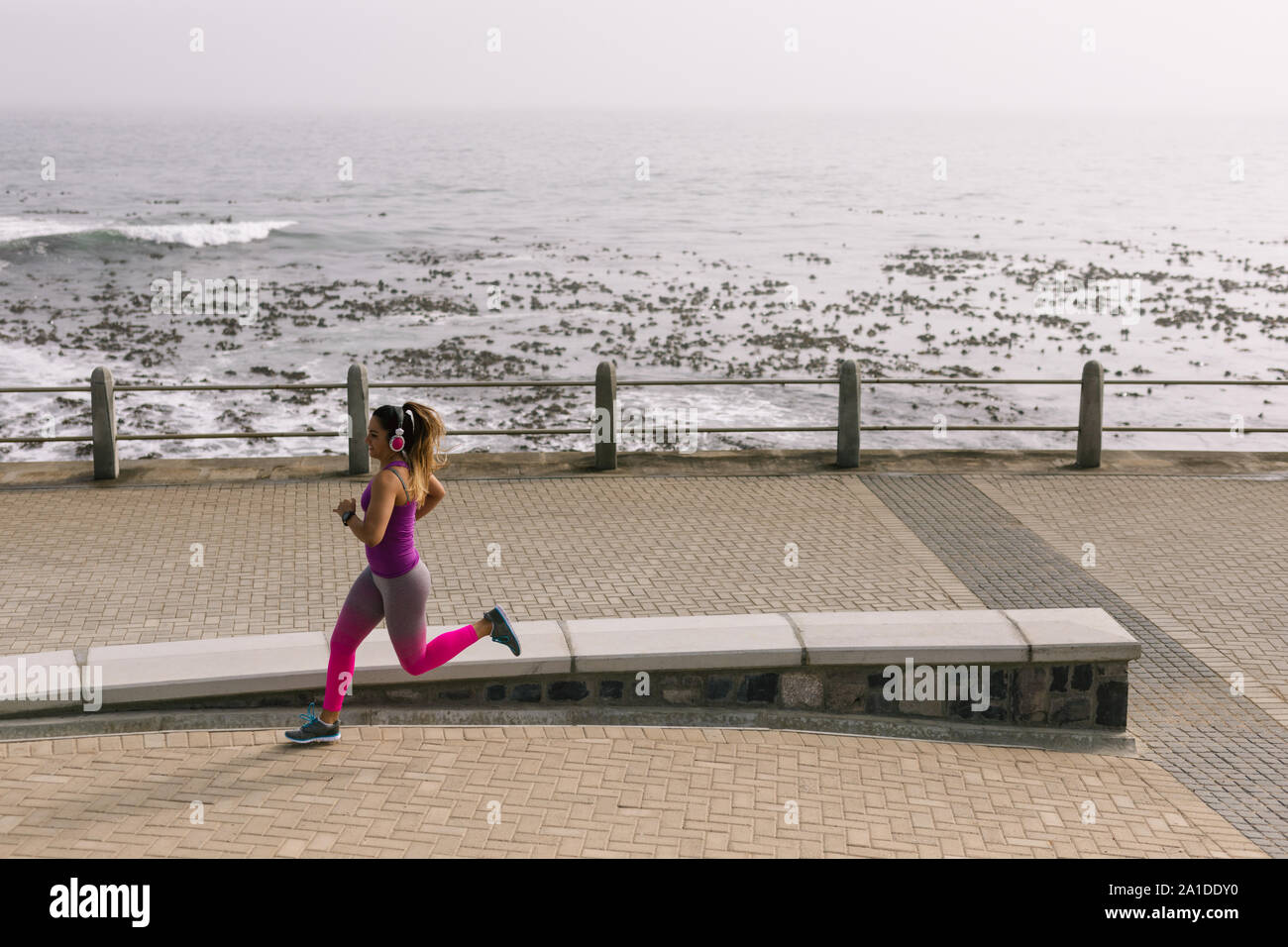 Woman exercising by the sea Stock Photo - Alamy