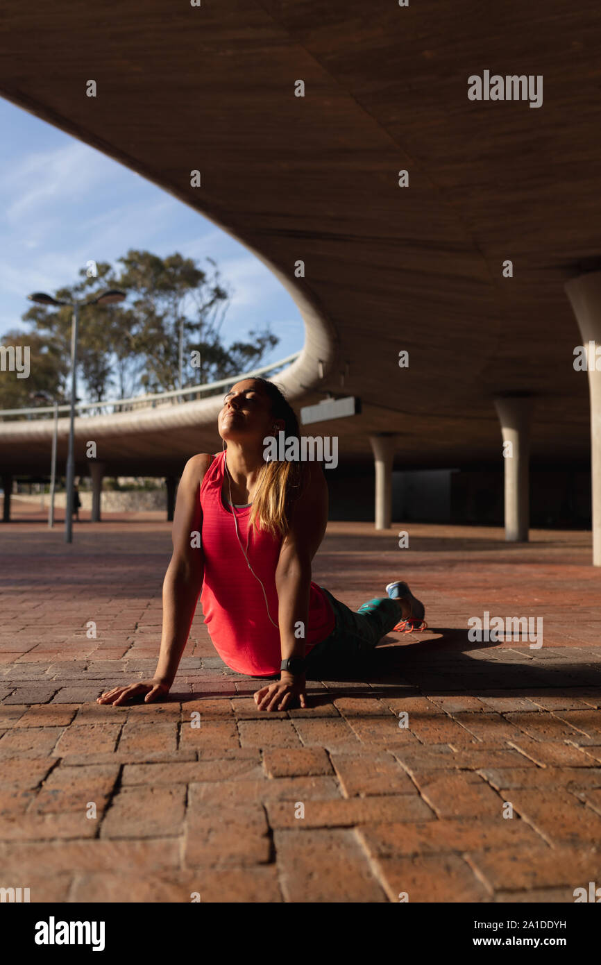 Woman exercising in a park Stock Photo - Alamy