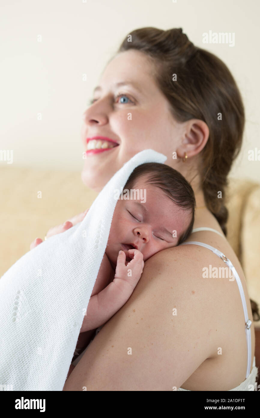 young mother with her newborn baby lying on her chest Stock Photo - Alamy