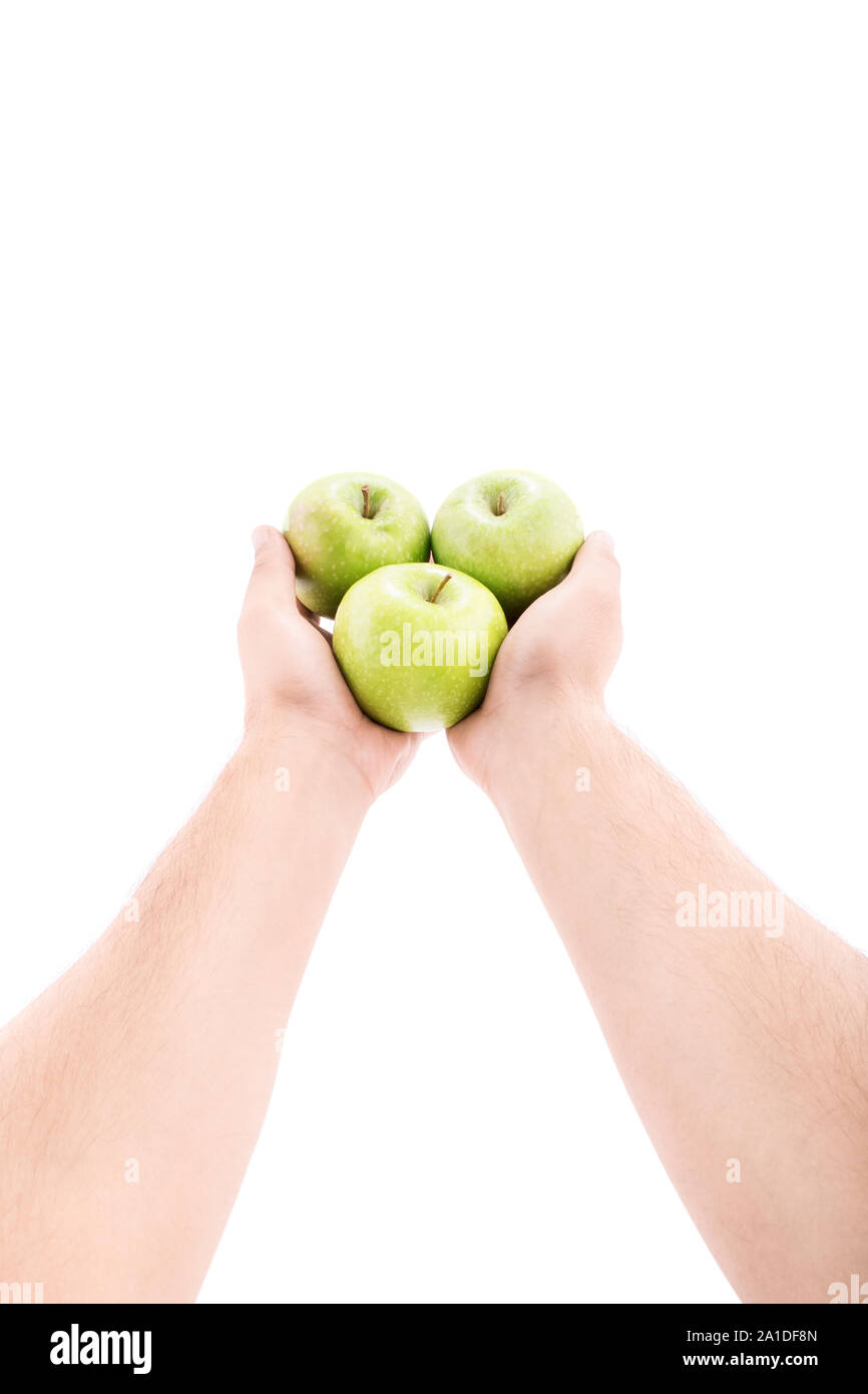 Stretched out male hands offering green apples, isolated on white ...