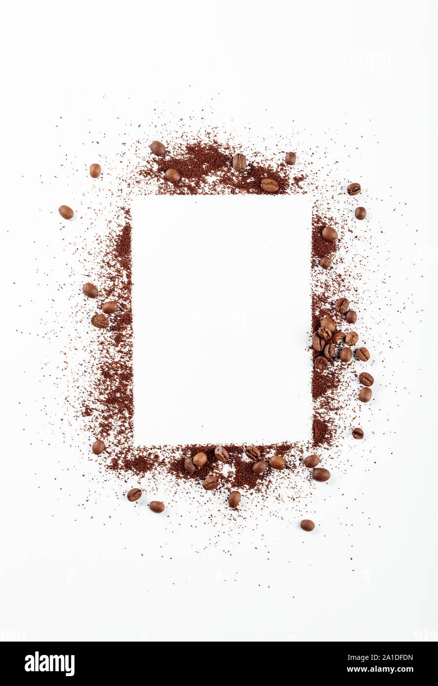 Ground coffee and beans on white background. Copy space for your text ...