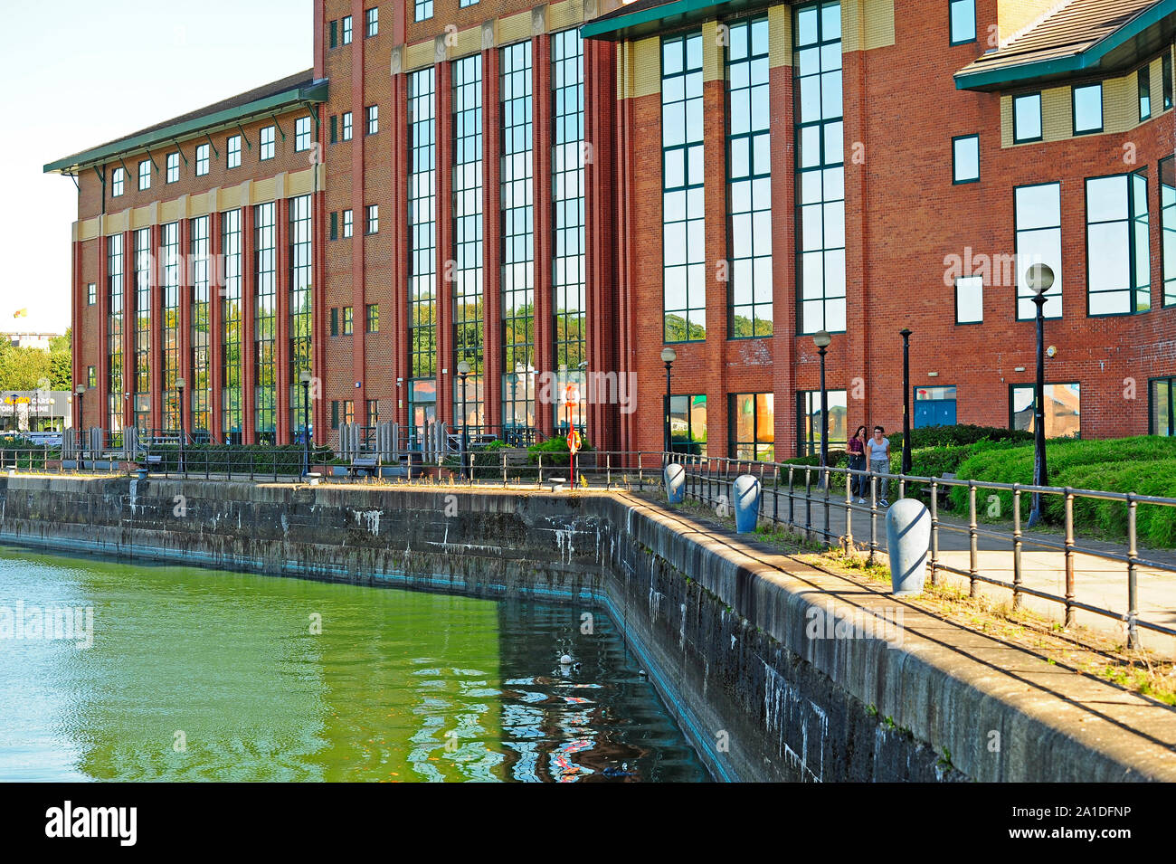 Office block on the side of Preston dock basin Stock Photo - Alamy