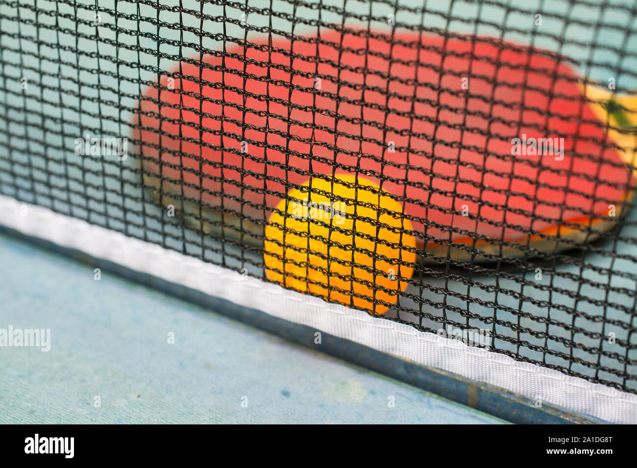 Ping pong paddles and ball on retro blue wooden background. Rackets ...