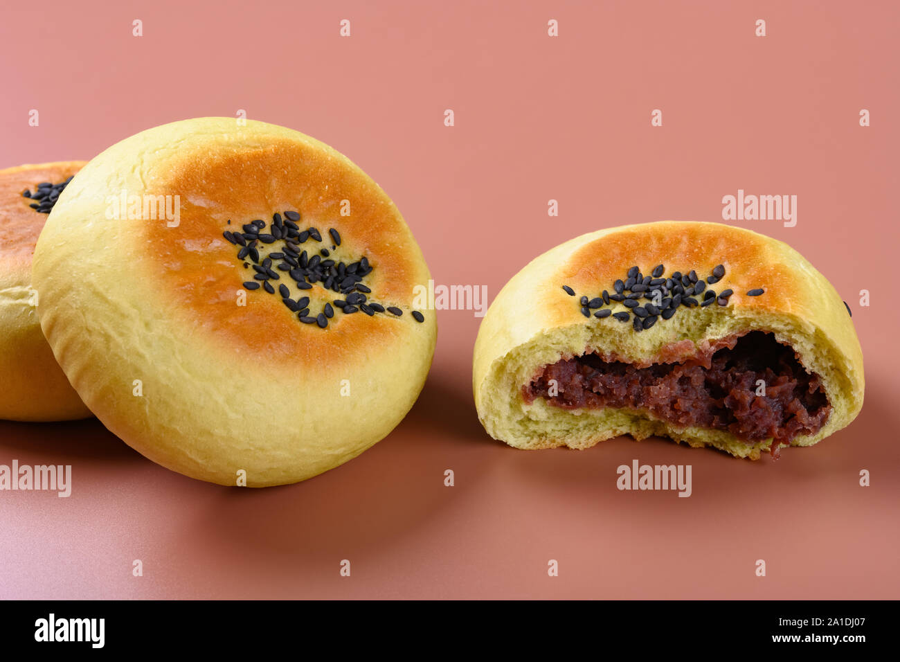 side view cut out red bean paste cake with some complete ones on a ...