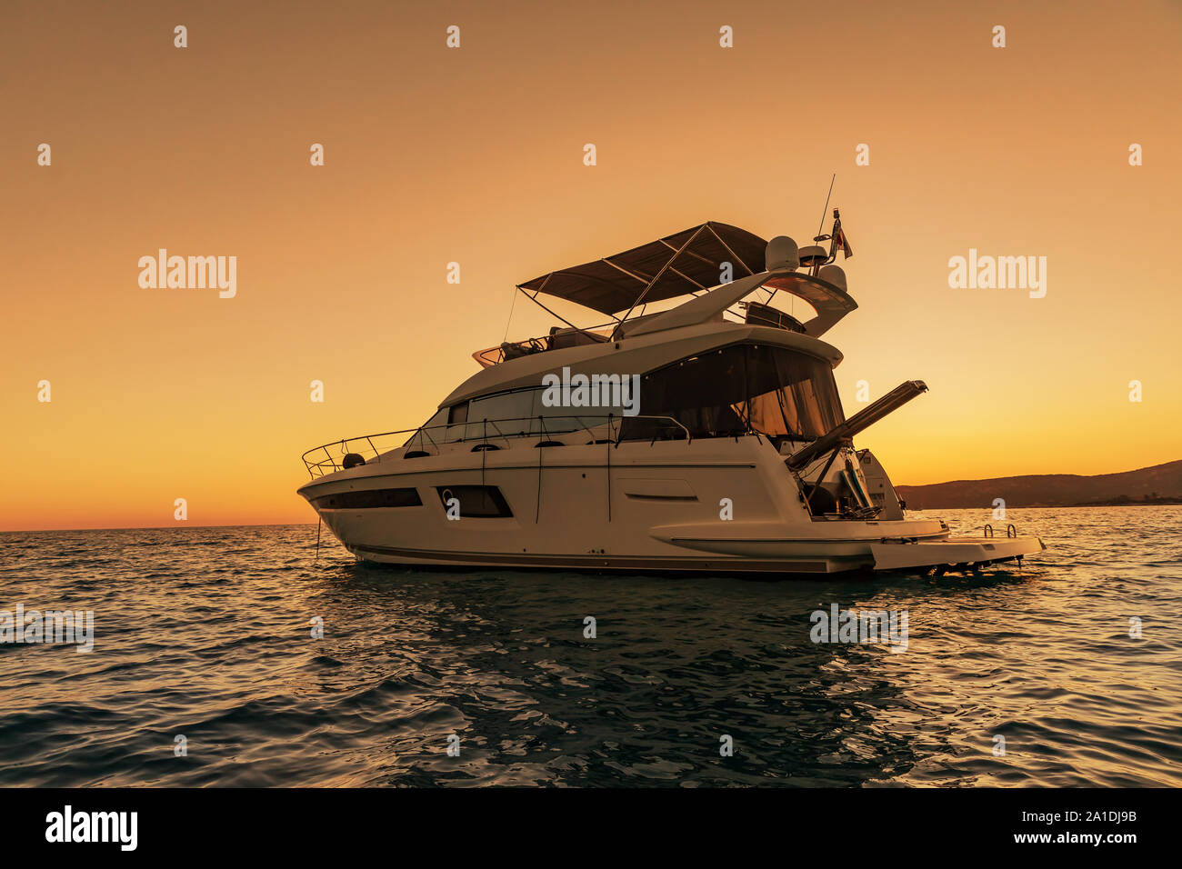 Luxury yacht at sea, colorful tint after sunset. Concept for vacation ...