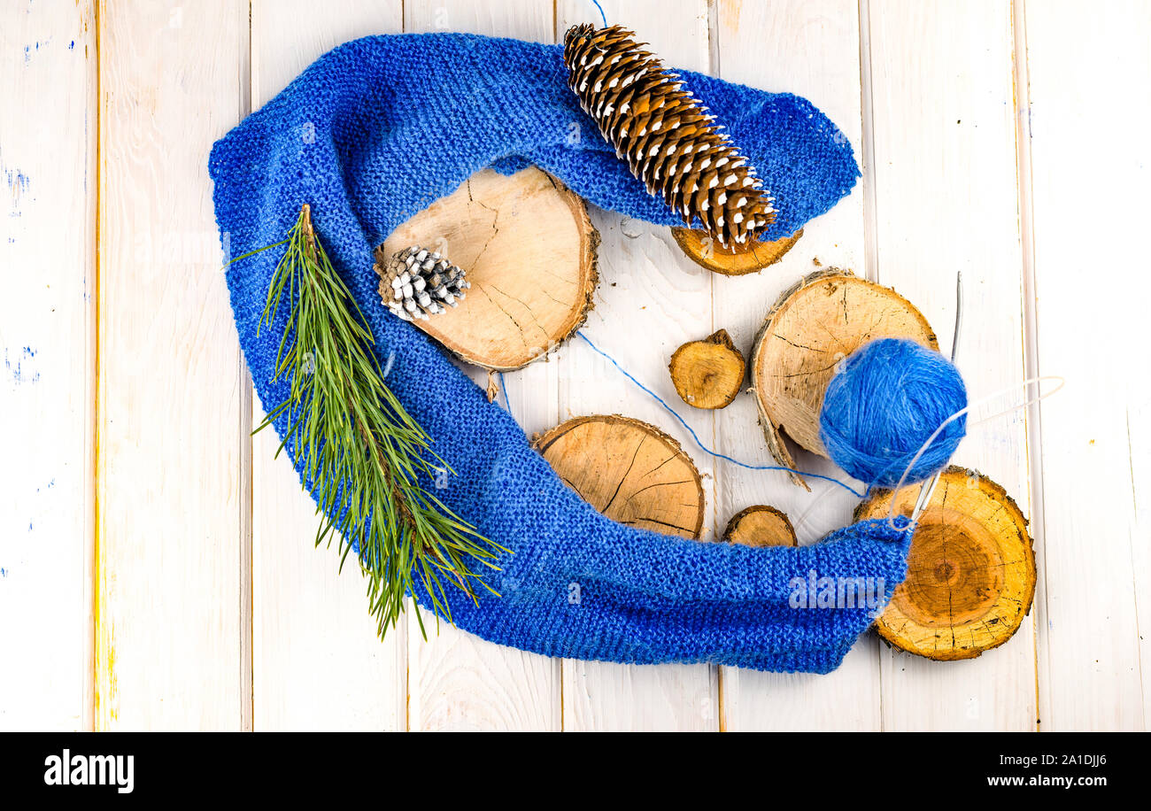 Wood pebble, bumps, cloth and a knitting thread tie on the background ...