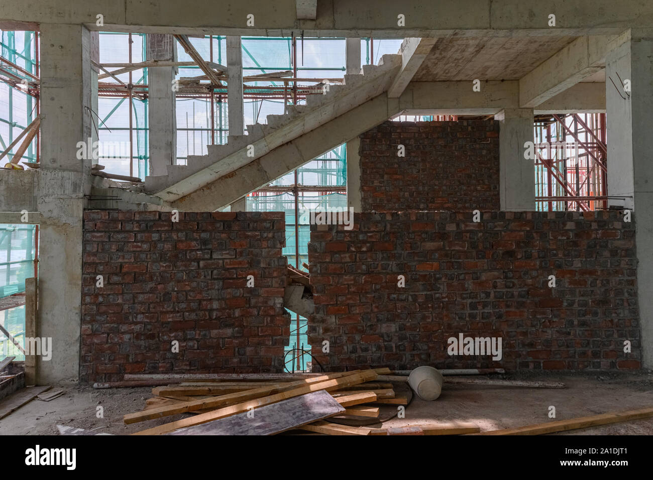 inside of an unfinished building with protection scaffolding and ...