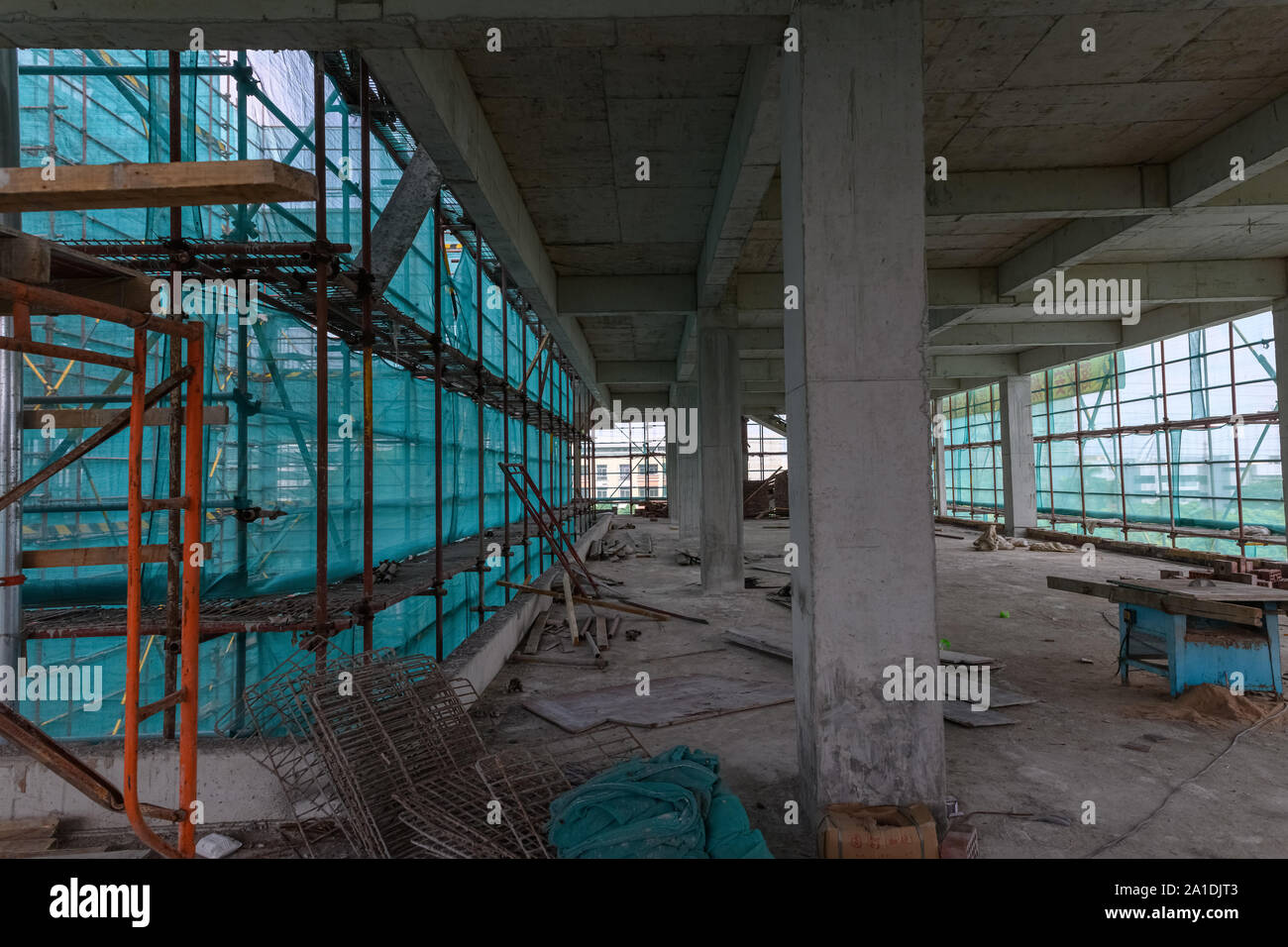 inside of an unfinished building with protection scaffolding and ...