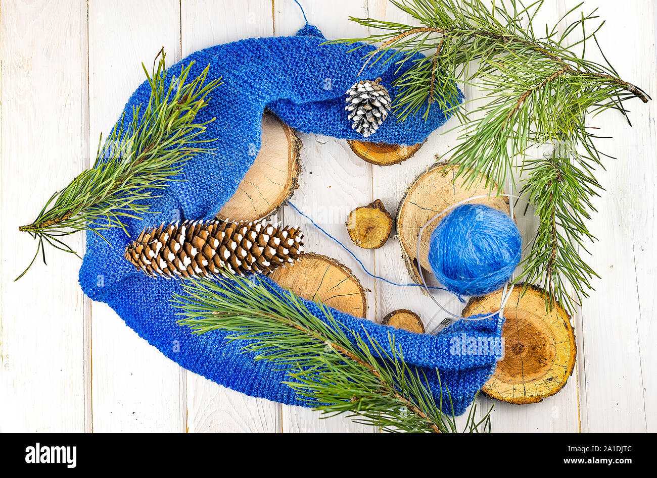 Wood pebble, bumps, cloth and a knitting thread tie on the background ...